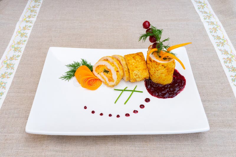 Creative Culinary Presentation Featuring Rolled Chicken with Garnishes ...