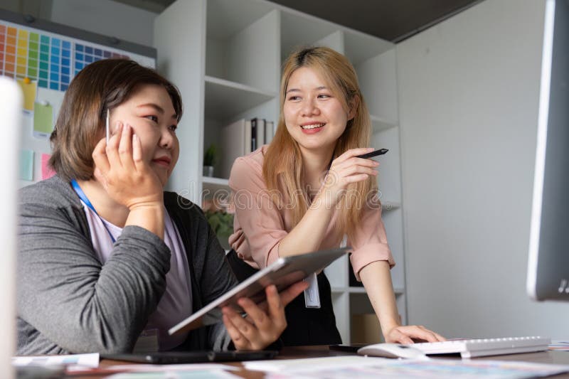 Creative Design Team Collaborating on a Project in a Modern Office ...