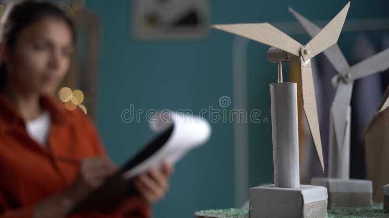 Creative Design Woman Working with 3D Wind Turbine Models in a Home ...