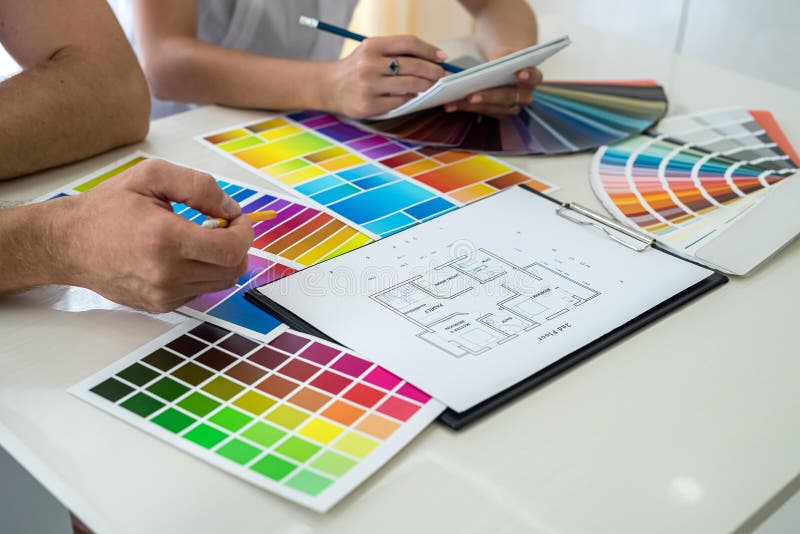 Creative Designers Making Some Notes about Project in Notebook Stock ...