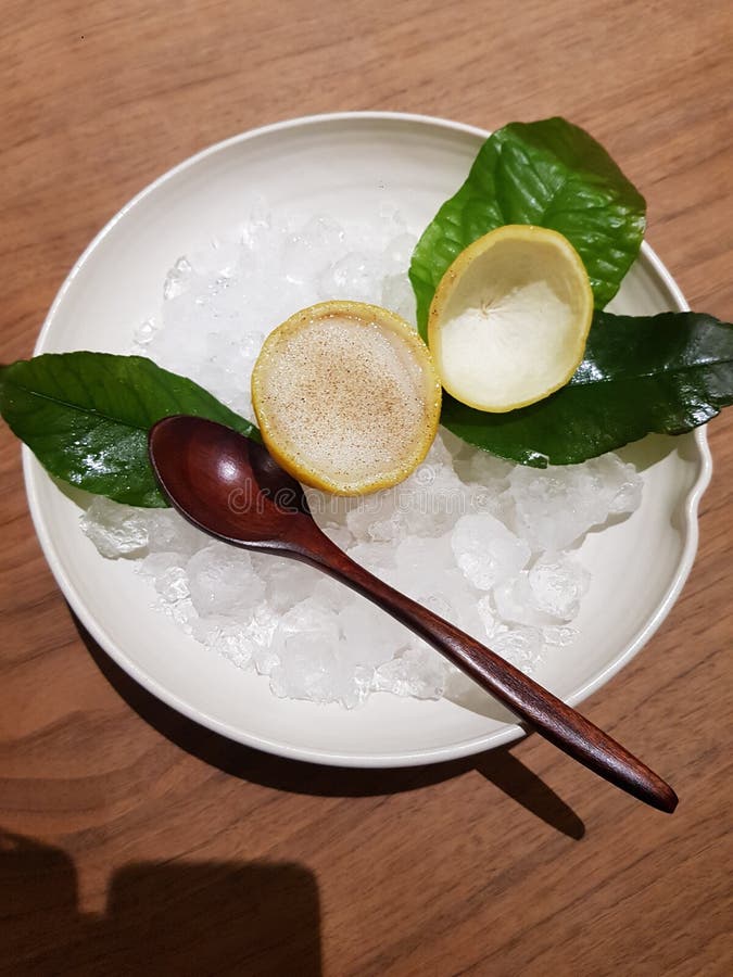 Creative Dessert - Lemon Sorbet in a Lemon Peel Stand, Served on Ice ...
