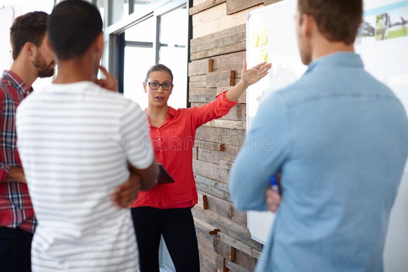 Creative Discussions. a Group of Designers Discussing Ideas in a ...
