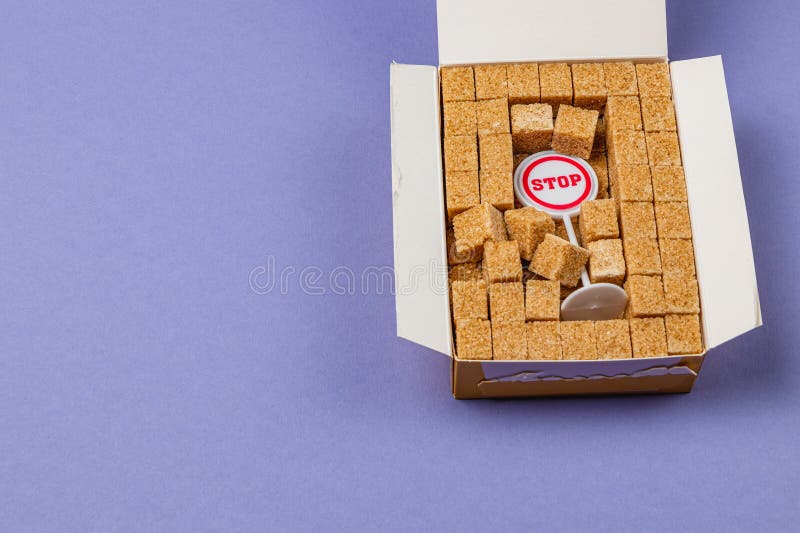 Creative Display of Sugar Cubes with a Stop Sign on a Purple Surface ...