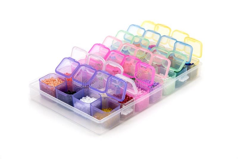 Creative Flatlay of Different Seed and Pearl Beads in the Box on Pink ...