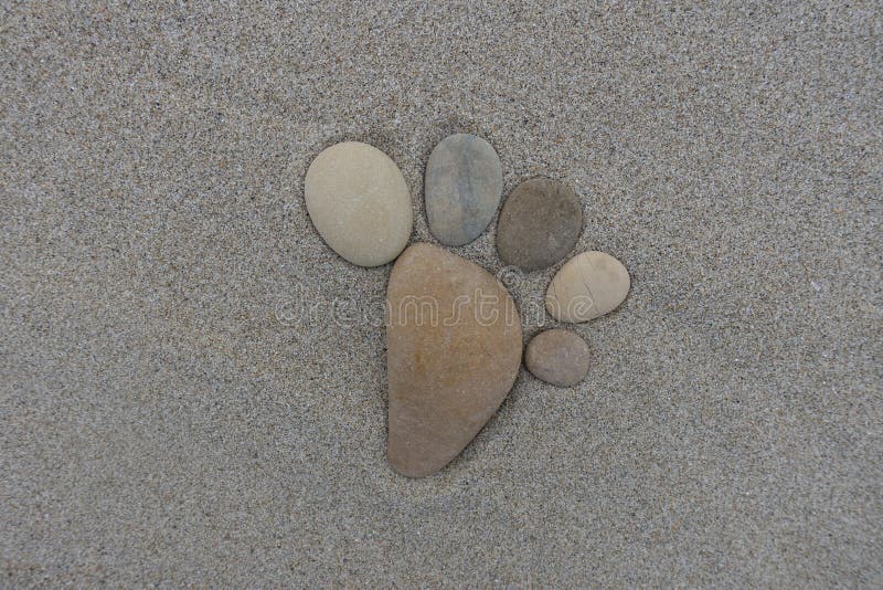 Creative Foot Composed with Pebbles Over Beach Sand Stock Photo - Image ...