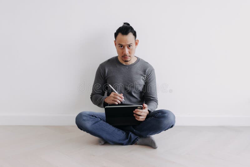 Creative Freelance Man Sitting on the Floor Working with Tablet. Stock ...