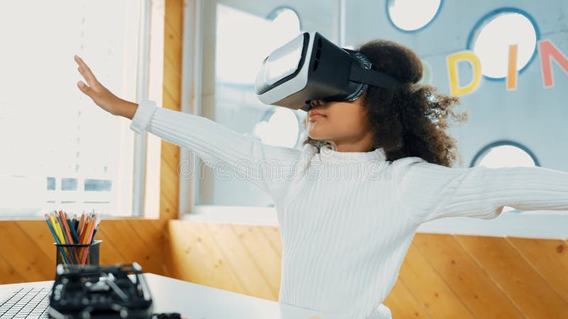 Girl Wearing VR Headset To Learning in Metaverse. Future Lifestyle. Erudition. Stock Photo ...