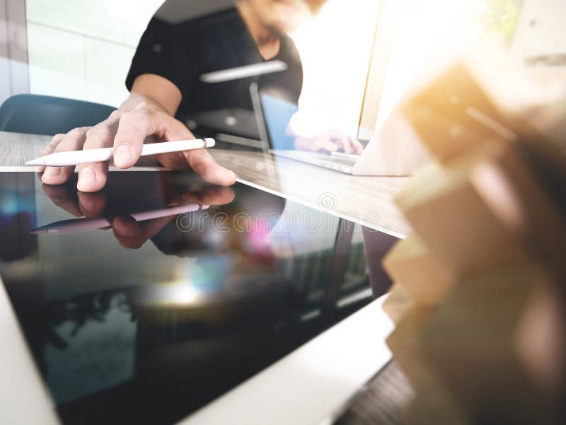 Creative Hand Working Digital Tablet and Wood Puzzle with Laptop Stock ...