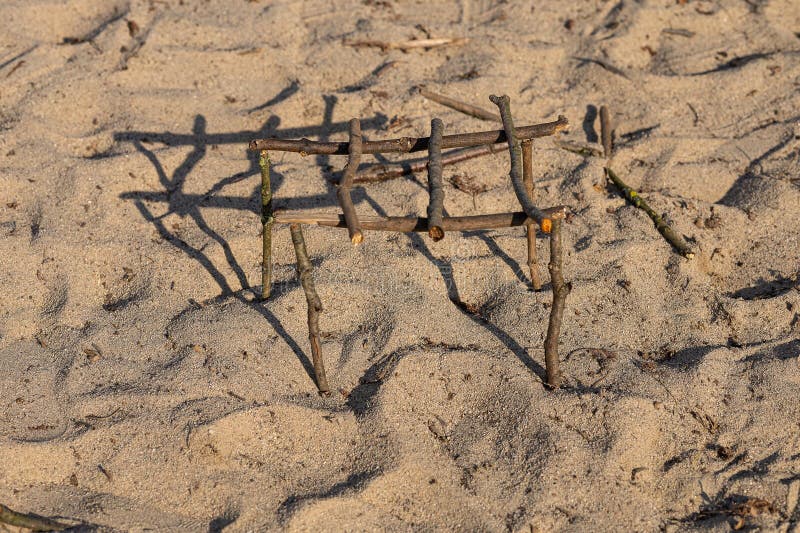 Creative Handmade Stick Structure Built by a Child on Sandy Ground in ...