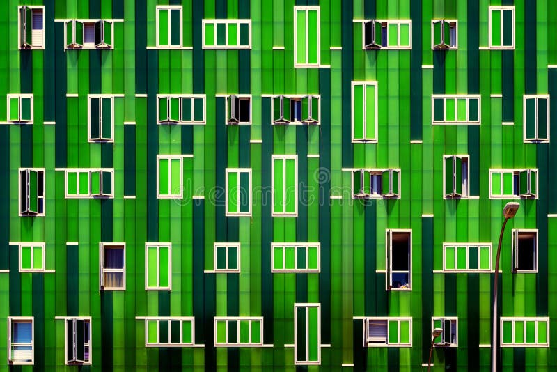 Creative Happy Bright Green Building with White Windows of Different ...