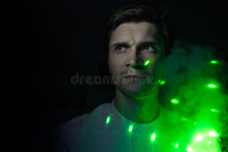 Creative Idea, Concept. Young Man and a Projection of Colored Patterns ...