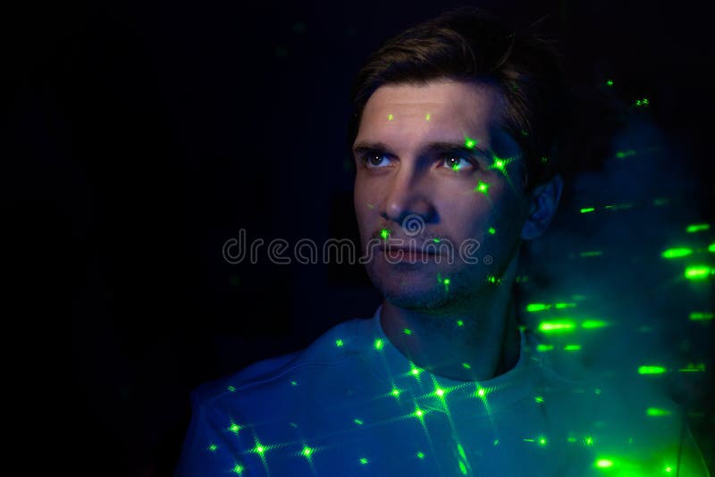 Creative Idea, Concept. Young Man and a Projection of Colored Patterns ...