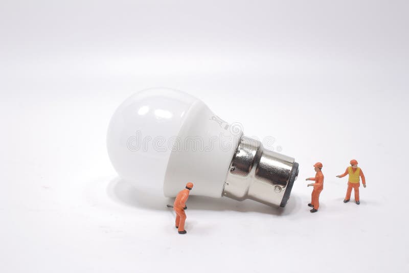 Creative Idea, Power or Energy Generator Concept, Miniature People ...