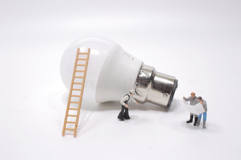 Creative Idea, Power or Energy Generator Concept, Miniature People ...