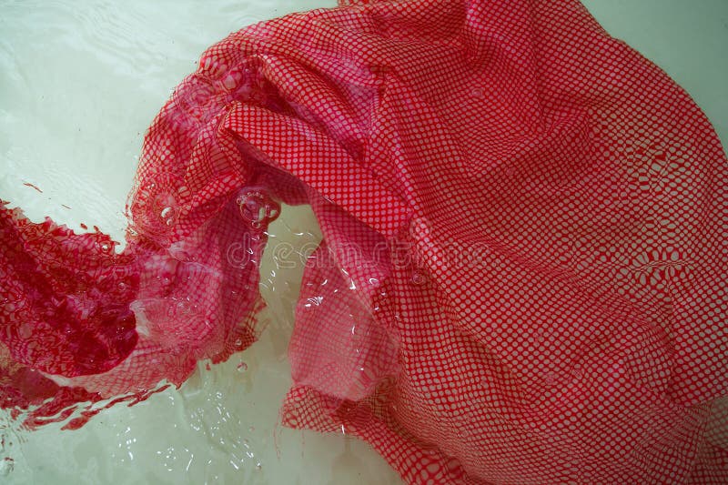 Creative Image of Wet Crumpled Red Material with White Circles ...