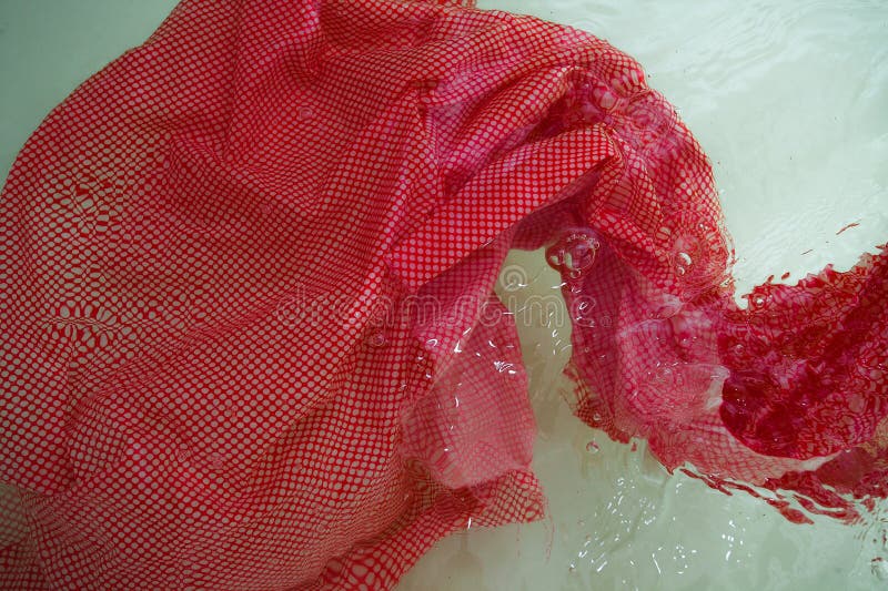 Creative Image of Wet Crumpled Red Material with White Circles ...