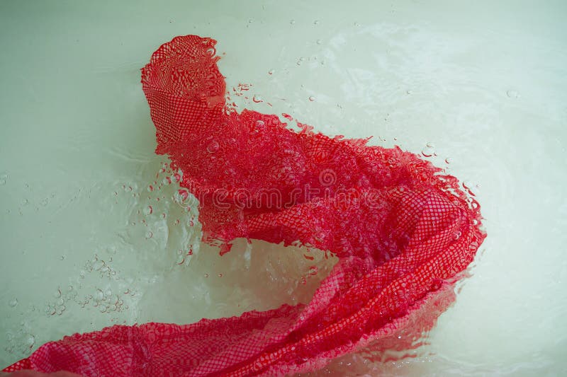 Creative Image of Wet Crumpled Red Material with White Circles ...