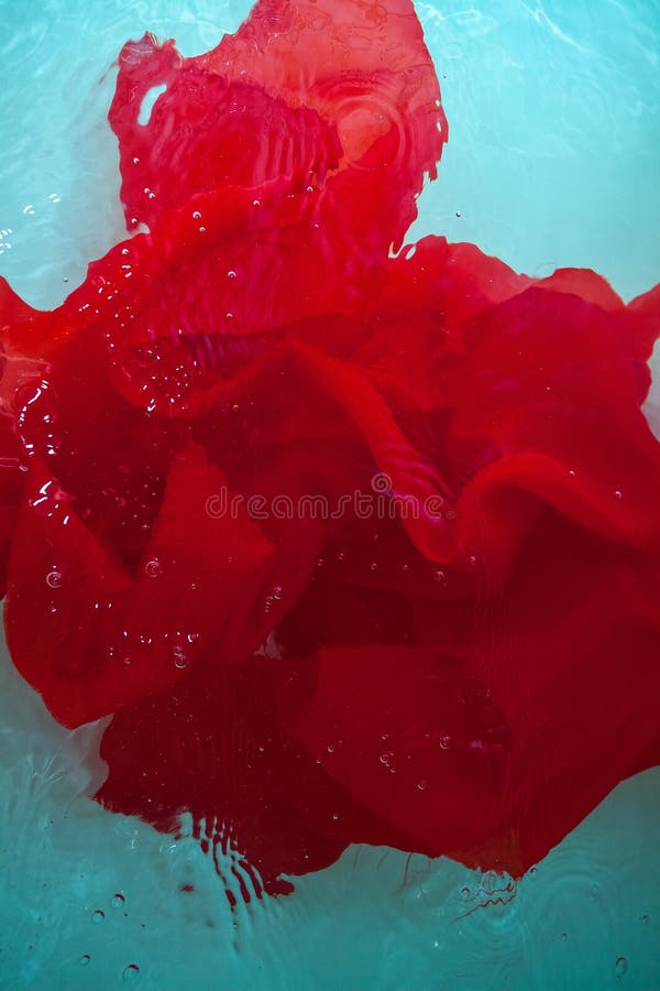 Image of Wet Red Rumpled Material in Blue Water with Waves, for Your ...