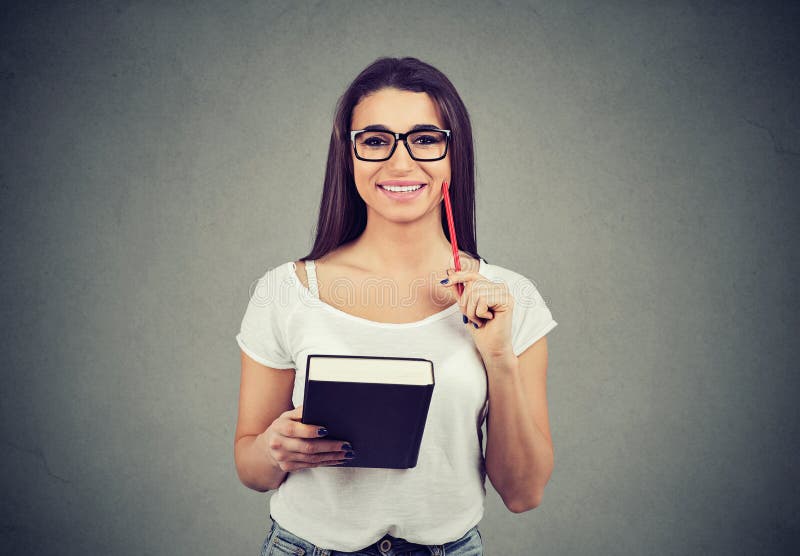 Creative Intelligent Woman Holding Notebook and a Pen Stock Image ...