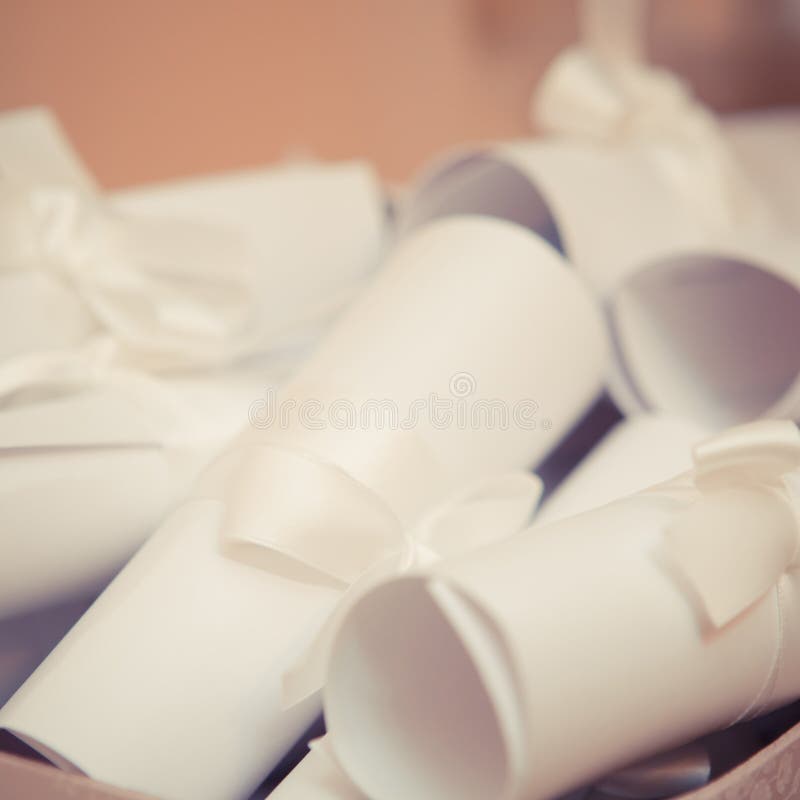 Creative Invitations are Roll Up in the Scrolls. Stock Photo - Image of ...