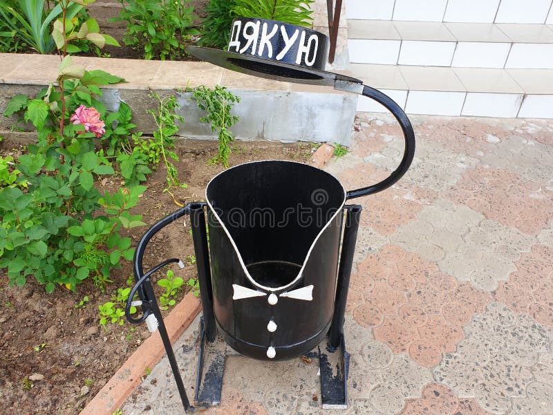 Creative Iron Garbage Can in the Shape of a Gentleman Stock Image ...