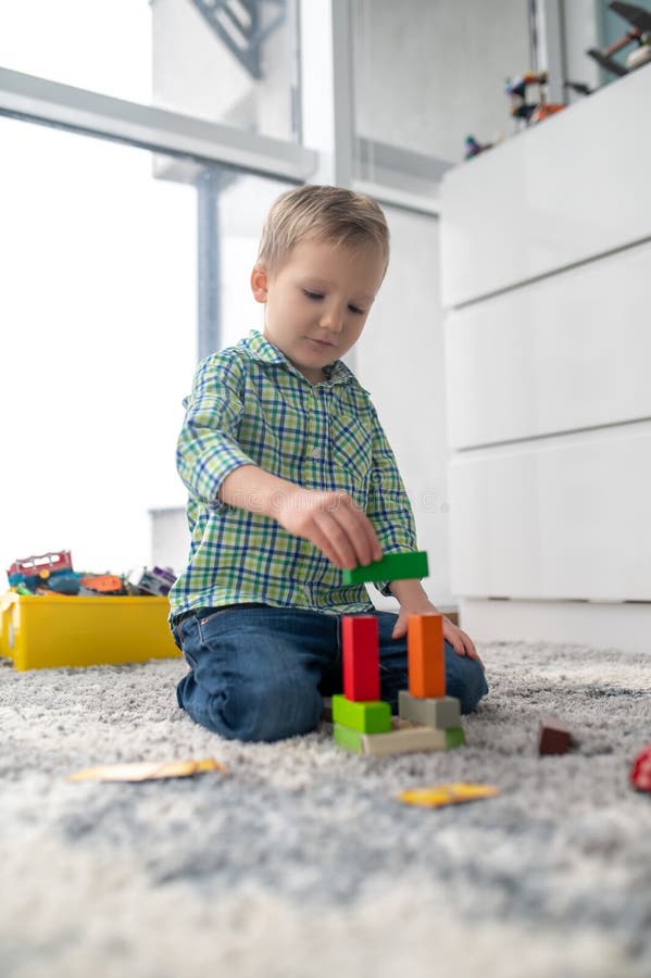 Creative Little Boy Constructing a Building Structure from Toy Blocks ...