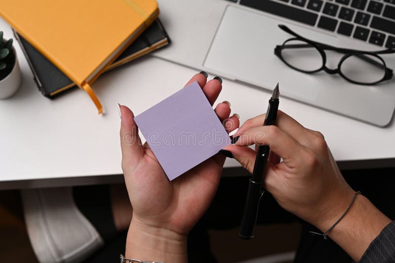 Man Hand Holding Pen and Sticky Note. Close Up View Stock Image - Image ...