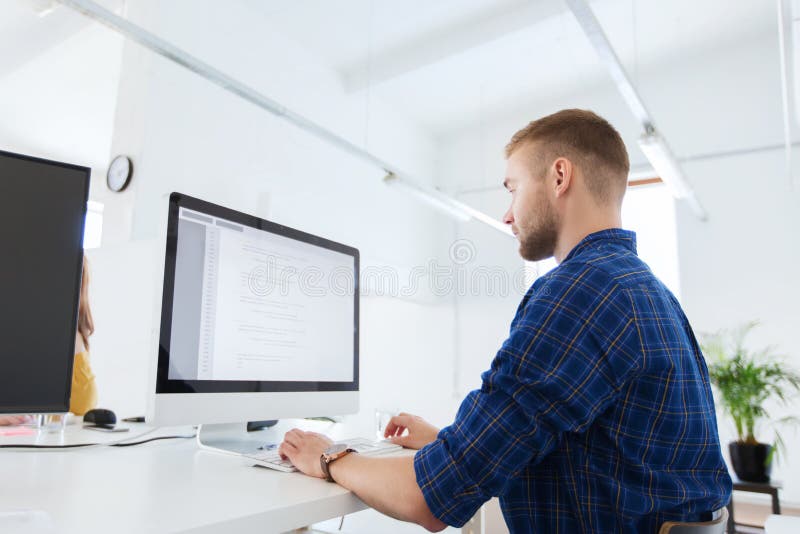 Man Working at Desk in Busy Creative Office Stock Image - Image of ...