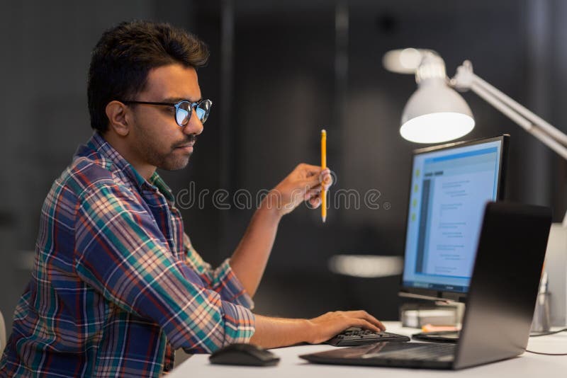 Creative Man Working with Laptop at Night Office Stock Image - Image of ...