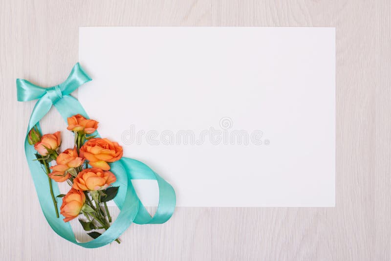 Creative Mock Up with a Card and Orang Rose. Empty Sheet of Paper ...