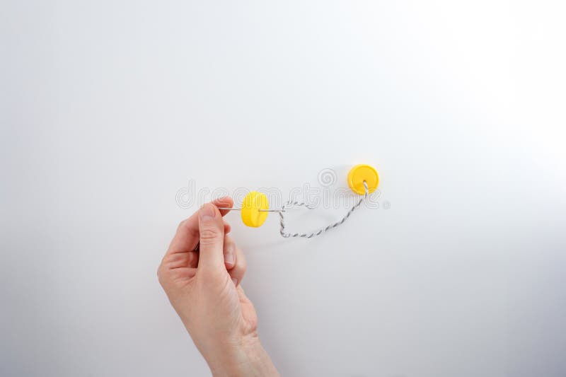 A Creative Moment in a DIY Project. a Yellow Plastic Bottle Cap is ...