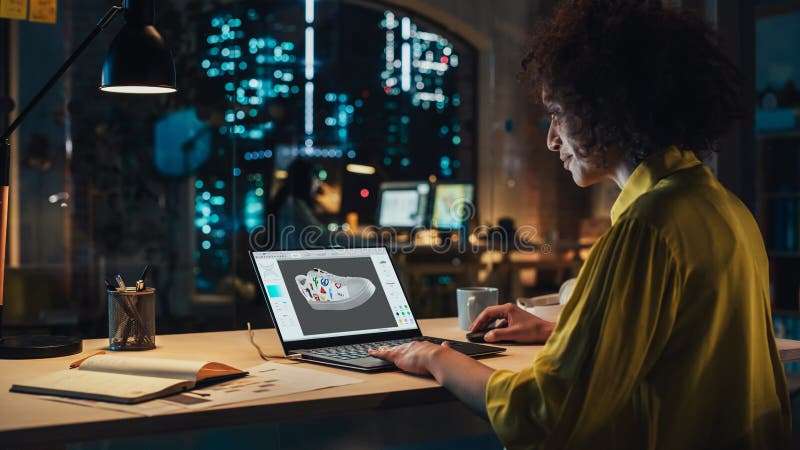 Creative Multiethnic Female Working on Laptop Computer with a Fashion ...