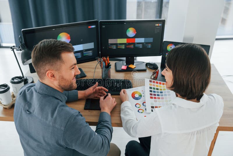 Creative Occupation. Two Designers Working Together in the Office Stock ...