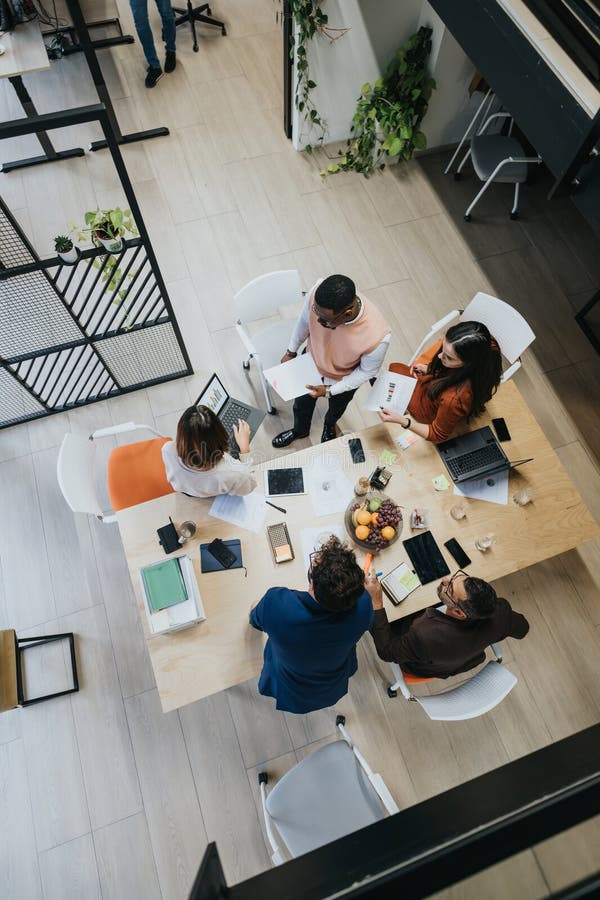 Multiethnic Colleagues in a Creative Office Discussing Business ...