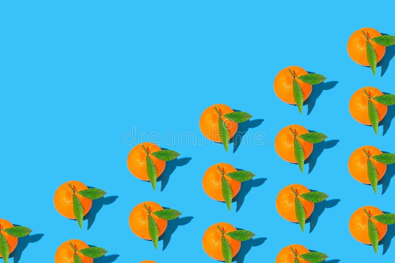 Creative Pattern Made of Fresh Orange Tangerin on Bright Blue ... Creative Pattern Made of Fresh Orange Tangerin on Bright Blue ...
