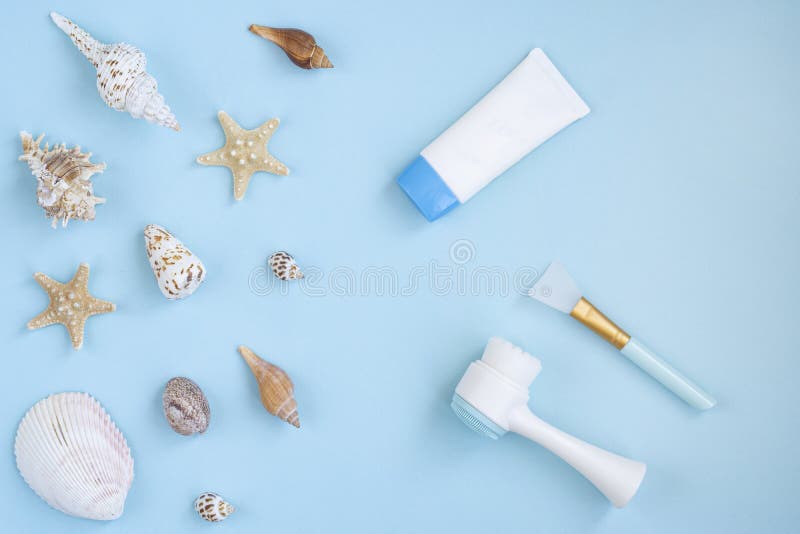 Creative Pattern of Shells and Skin Care Products on Blue Background ...