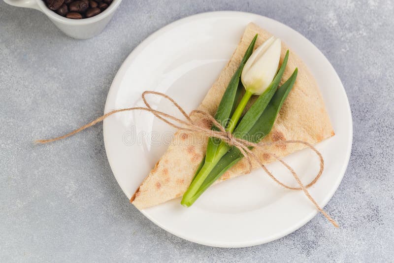 Creative Peace of Pizza with Flowers Tulips in Plate Stock Photo ...
