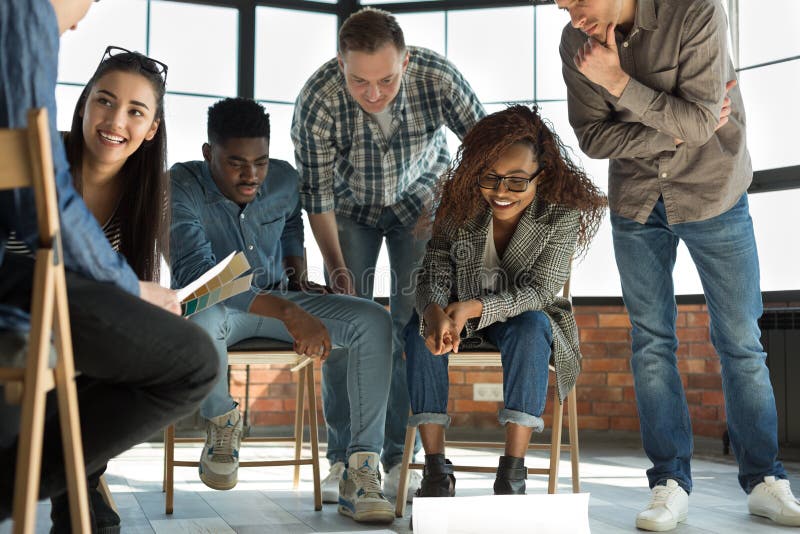 Creative People Looking at Project Plan on Floor Stock Photo - Image of ...