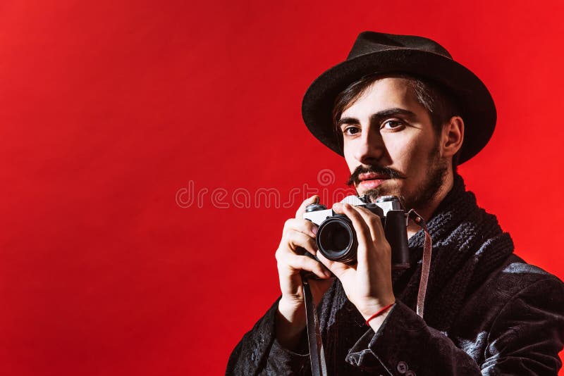 Creative Photographer Posing in Studio with Camera Stock Photo - Image ...