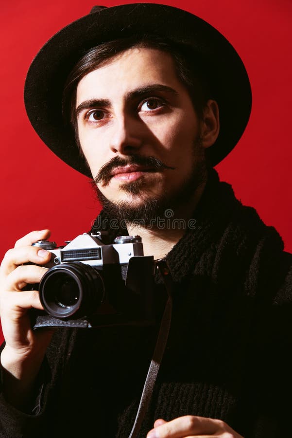 Creative Photographer Posing in Studio with Camera Stock Photo - Image ...