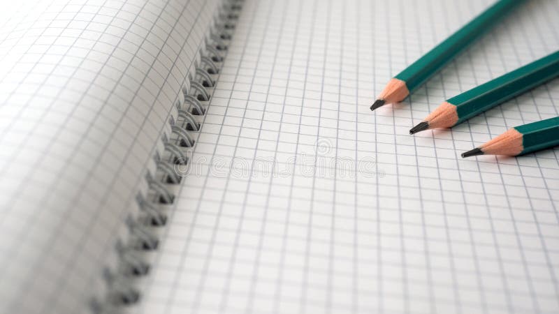 Creative Planning with Pencils and Notebook on a Grid Background Stock ...