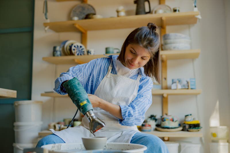 A Creative Pottery Artist Engaging Deeply with the Clay Material in ...