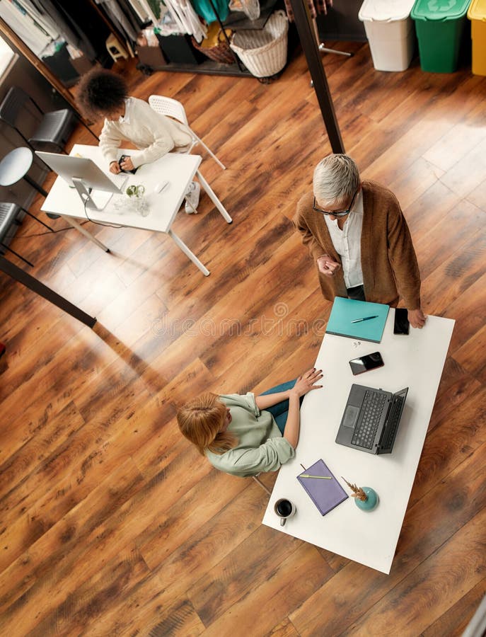 Colleagues Fashion Designers Use a Tablet in a Work Environment Stock ...