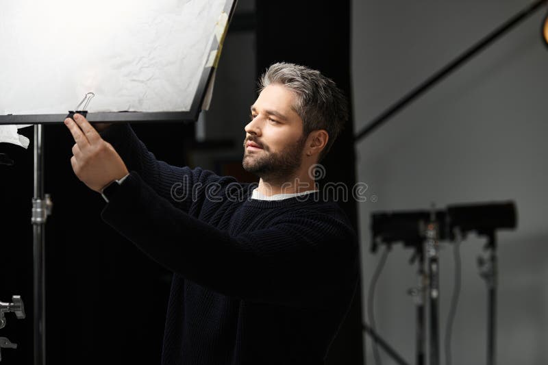 Creative Professional Adjusting Lighting Equipment during Stock Image ...