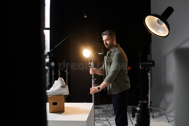 Creative Professional Adjusting Lighting for a Stock Image - Image of ...