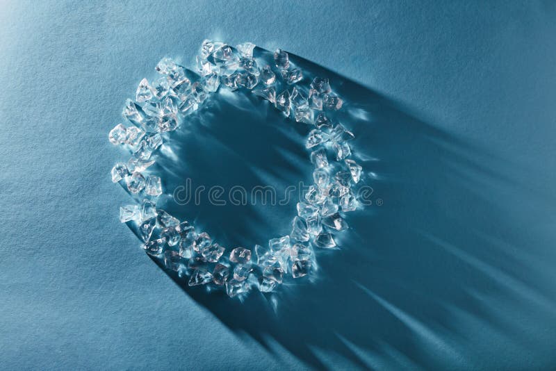 Creative Round Frame of Ice Cubes on a Blue Background. Flat Lay Stock ...