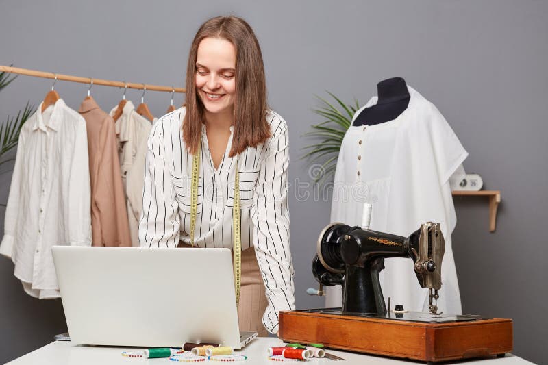 Creative Sewing Sewer Brainstorming New Collection Working on Laptop in ...