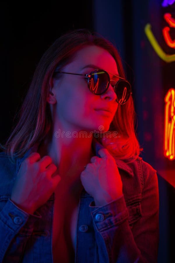 Creative Sexual Portrait Of A Girl In Neon Lighting With Glasses Night