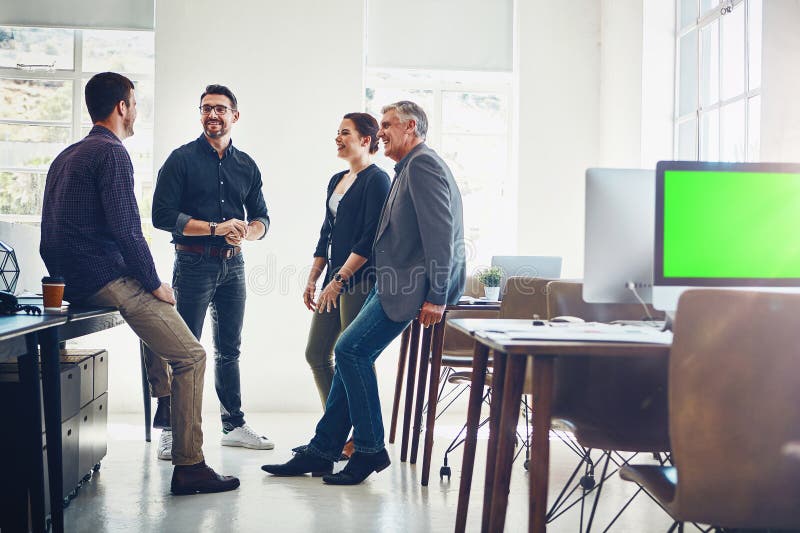 Creative Solutions is Our Goal. a Group of Designers Having a ...