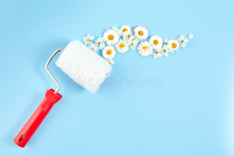 Creative Spring Blossom Concept. Paint Roller with Flower on a Blue ...